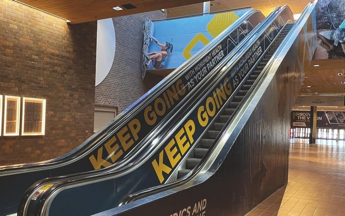 Escalator wrapped to raise health awareness services in South Dakota ...